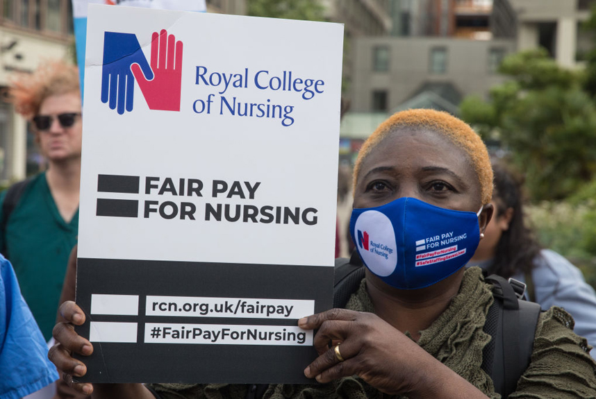 Government urged to reverse NHS pay cuts as nurses back historic ...