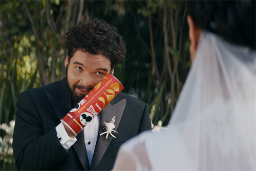 A man spends life with a Pringles can on his hand in Super Bowl spot ...