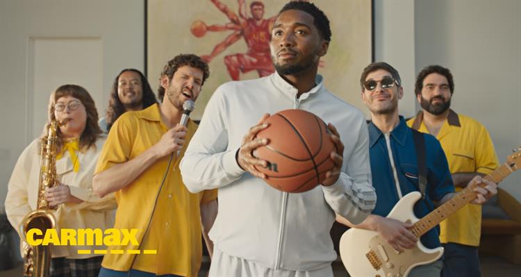 CarMax drives in the paint with Paige Bueckers and Donovan Mitchell ...